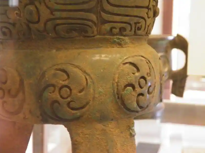 Sun with spiral rays, solar disc, sun disc, ritual vessels